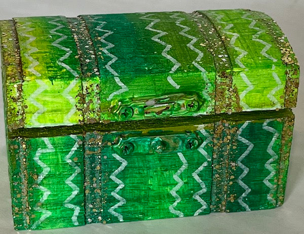 A small wooden box shades of green